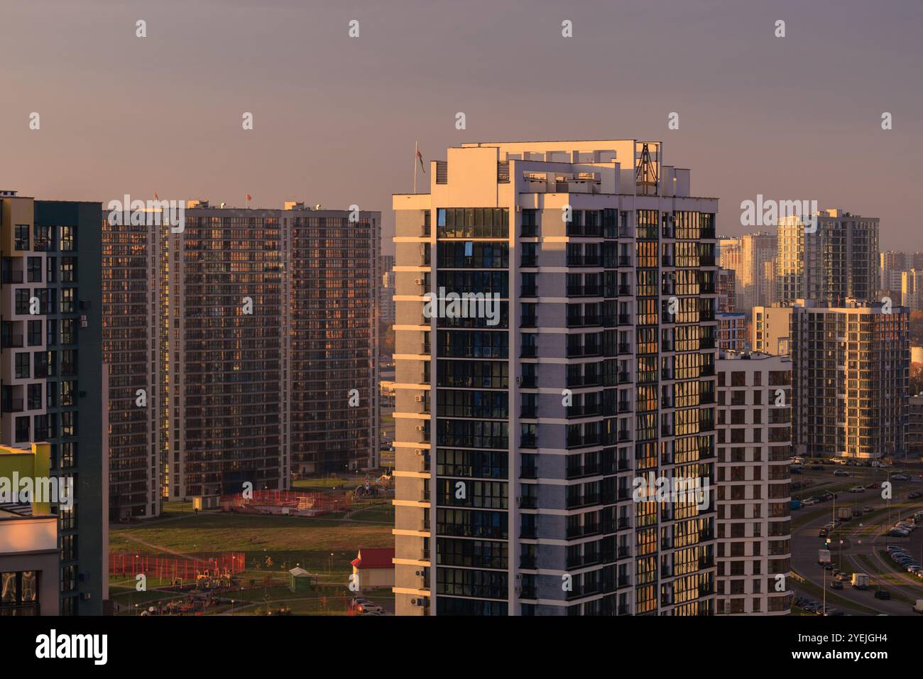 Evening view of the city. Sunset orange sky and beautiful cityscape ...