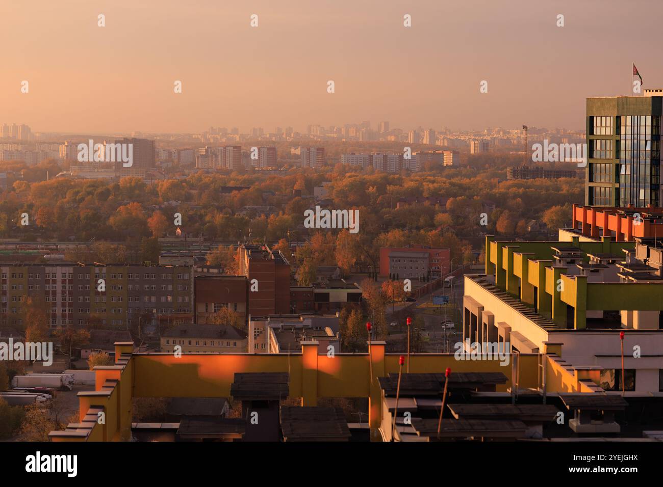 Evening view of the city. Sunset orange sky and beautiful cityscape ...