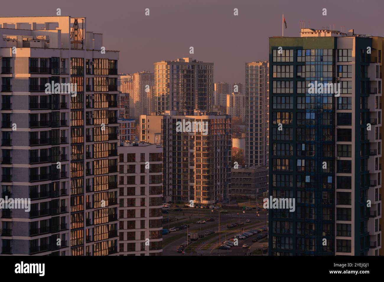 Evening view of the city. Sunset orange sky and beautiful cityscape ...