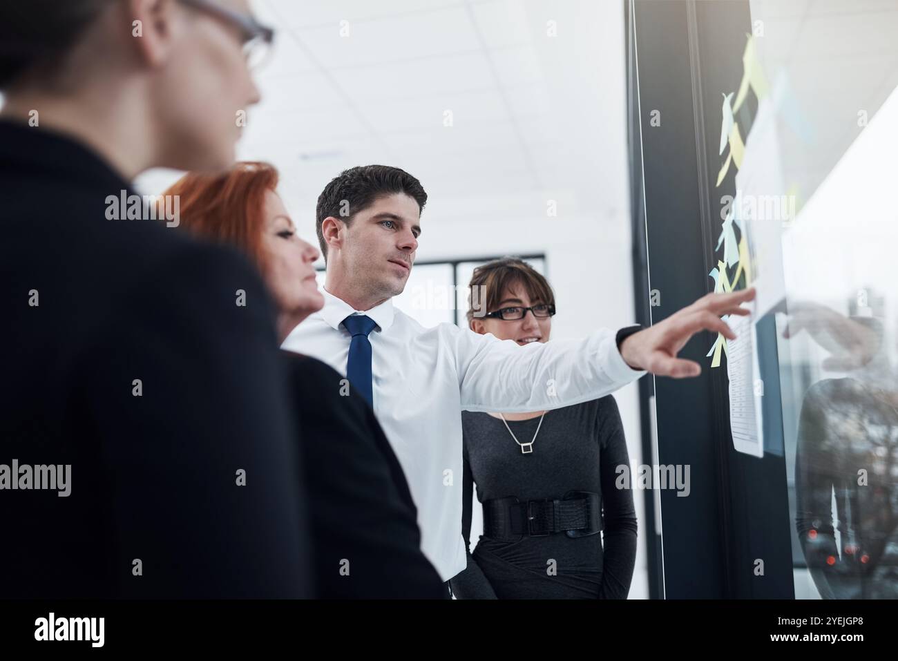 Teamwork, reading and planning of group, glass and collaboration of ...