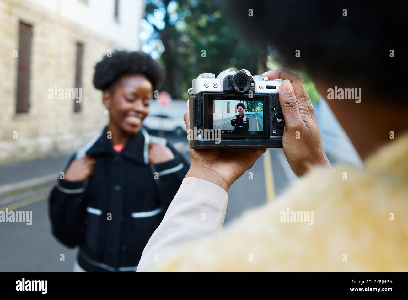 Young Woman Posing for a Street Photo Shoot Captured on a Digital ...