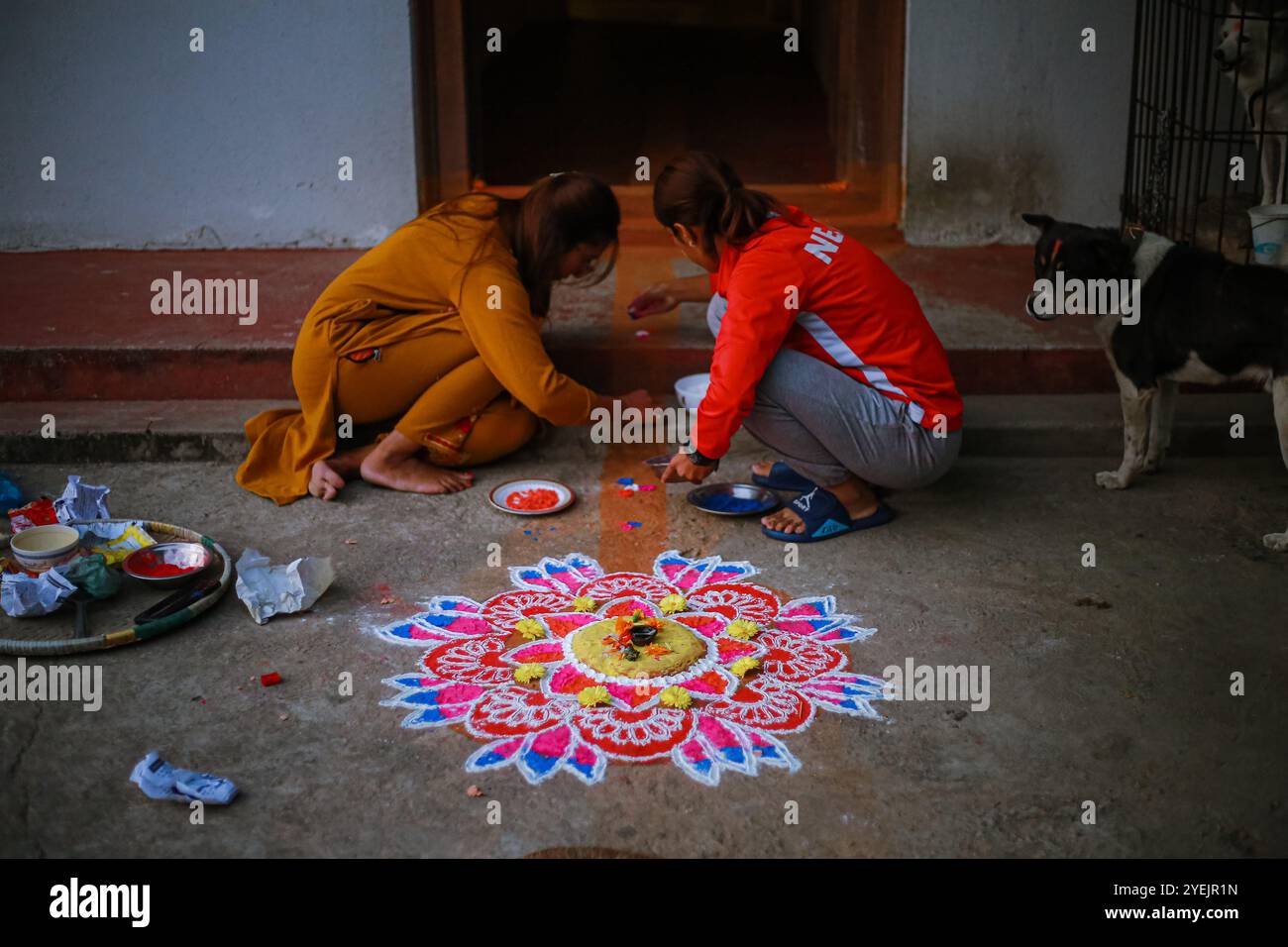 Bhaktapur, Bagmati, Nepal. 31st Oct, 2024. Girls making Rangoli li ...