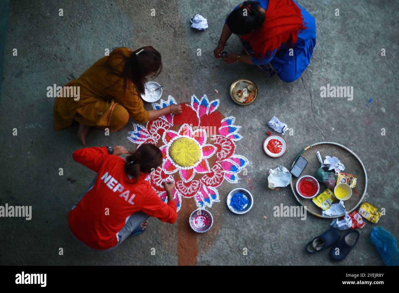 Bhaktapur, Bagmati, Nepal. 31st Oct, 2024. Girls making Rangoli li ...