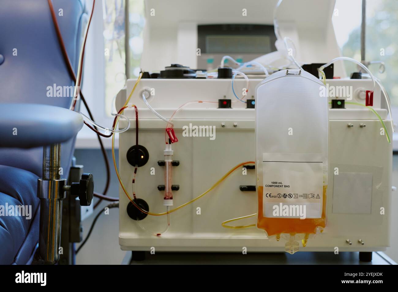 Detailed view of medical equipment used in blood donation process, featuring a blood bag and ...