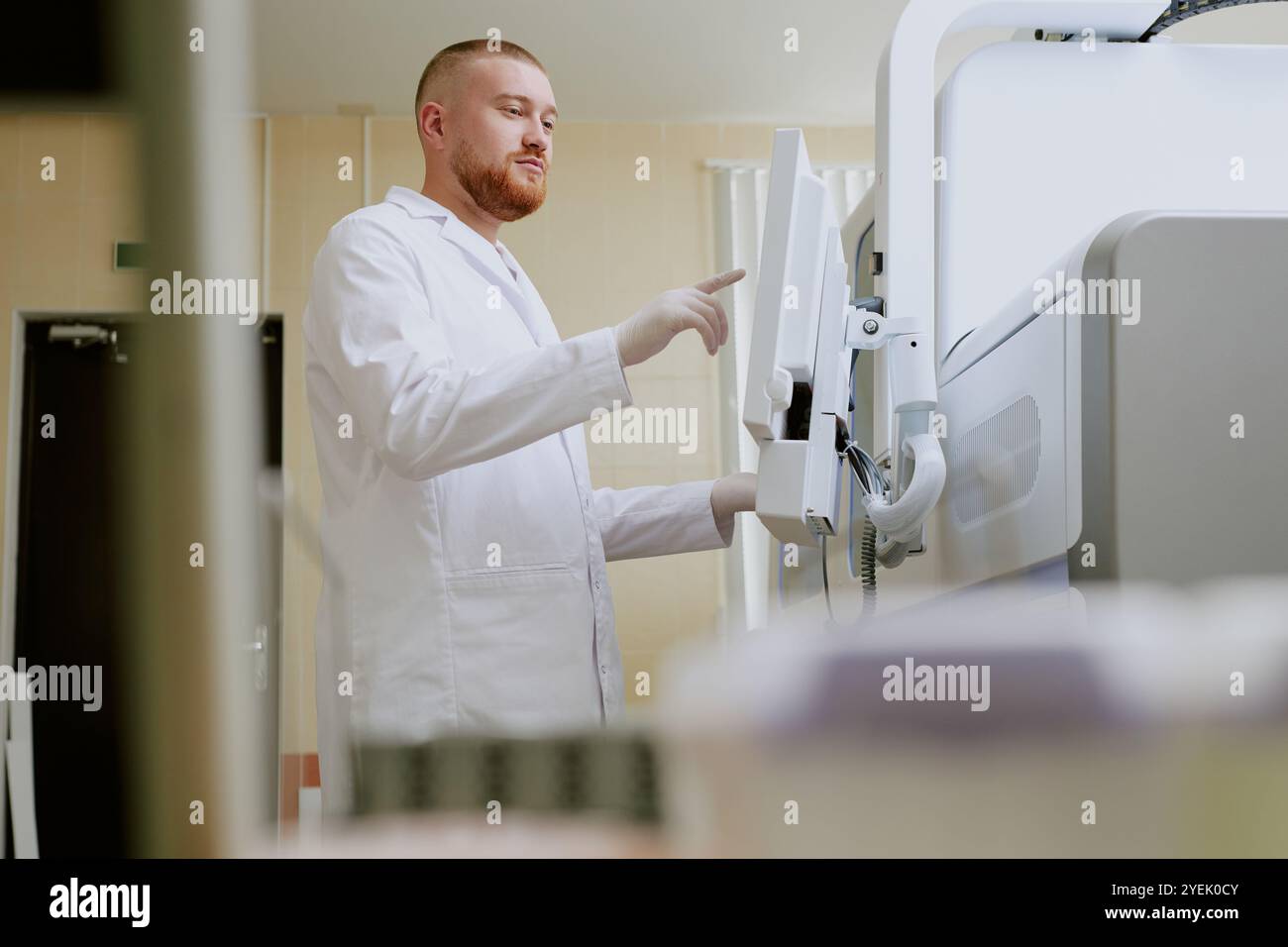 Medical professional using modern diagnostic equipment in laboratory ...