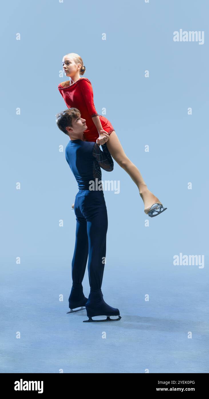 Professional figure skating couple demonstrating elegant lift during ...