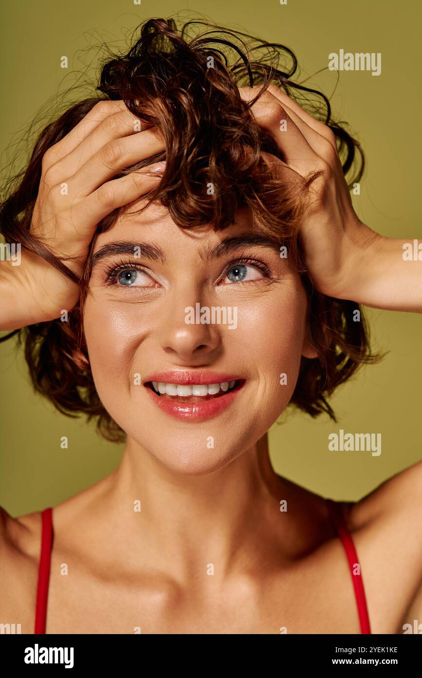Woman smiles joyfully holding hi-res stock photography and images - Alamy