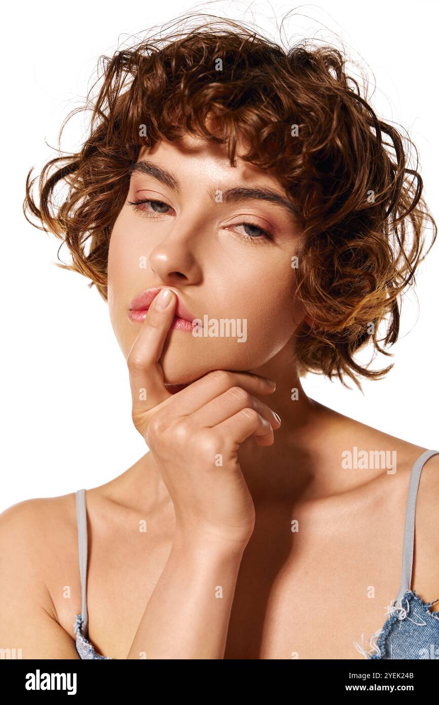 This young woman seems lost in thought, her expression revealing ...