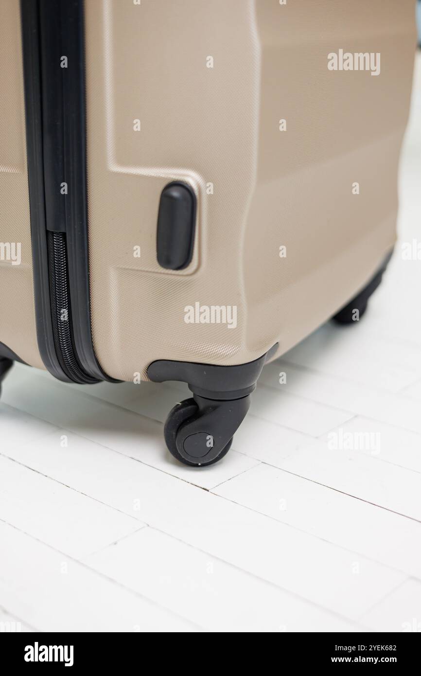 Golden suitcases with wheels isolated on white background. Suitcase for ...