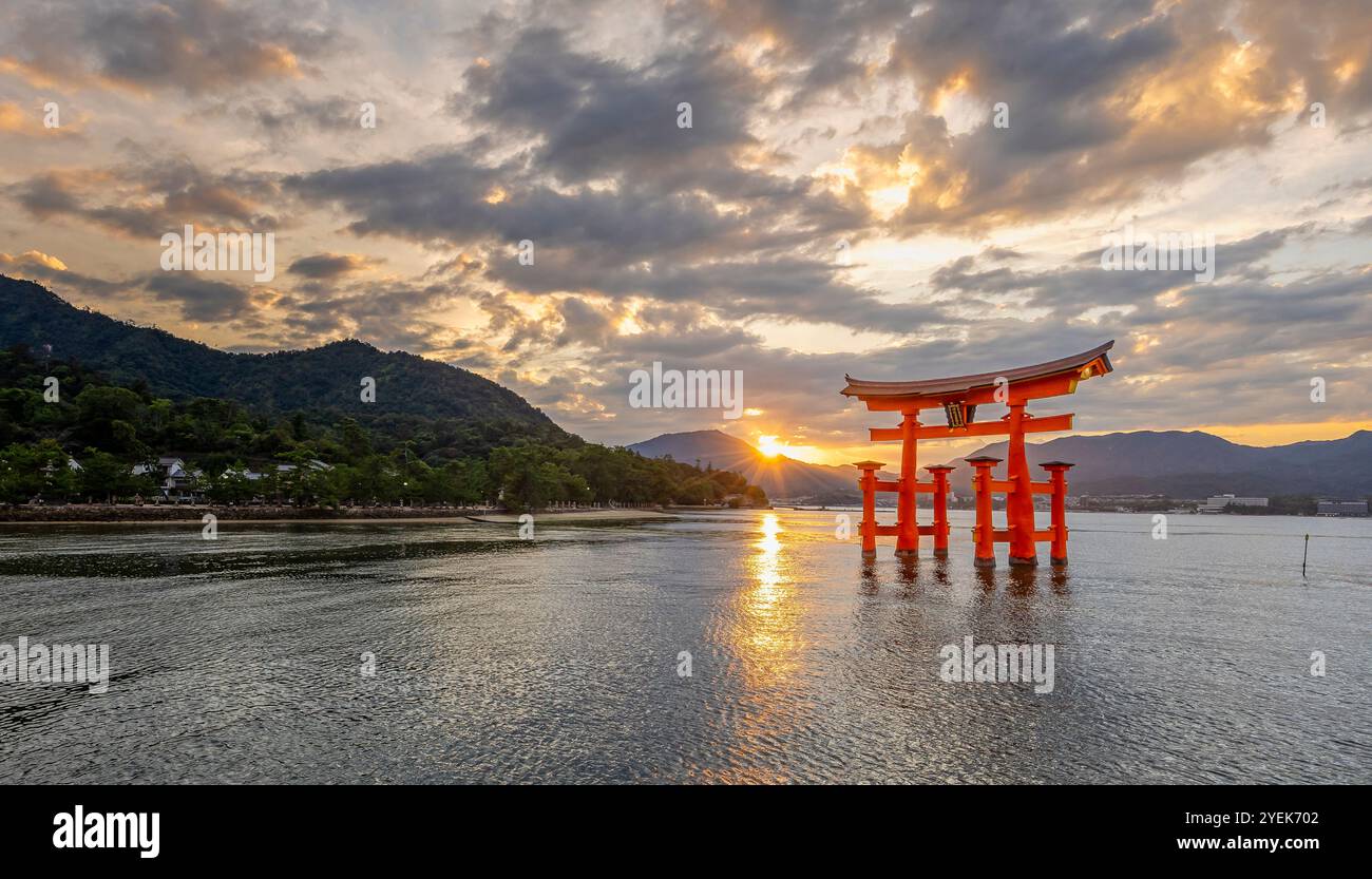 Iconic floating orange Torii gate in sea near the Itsukashima shrine at ...
