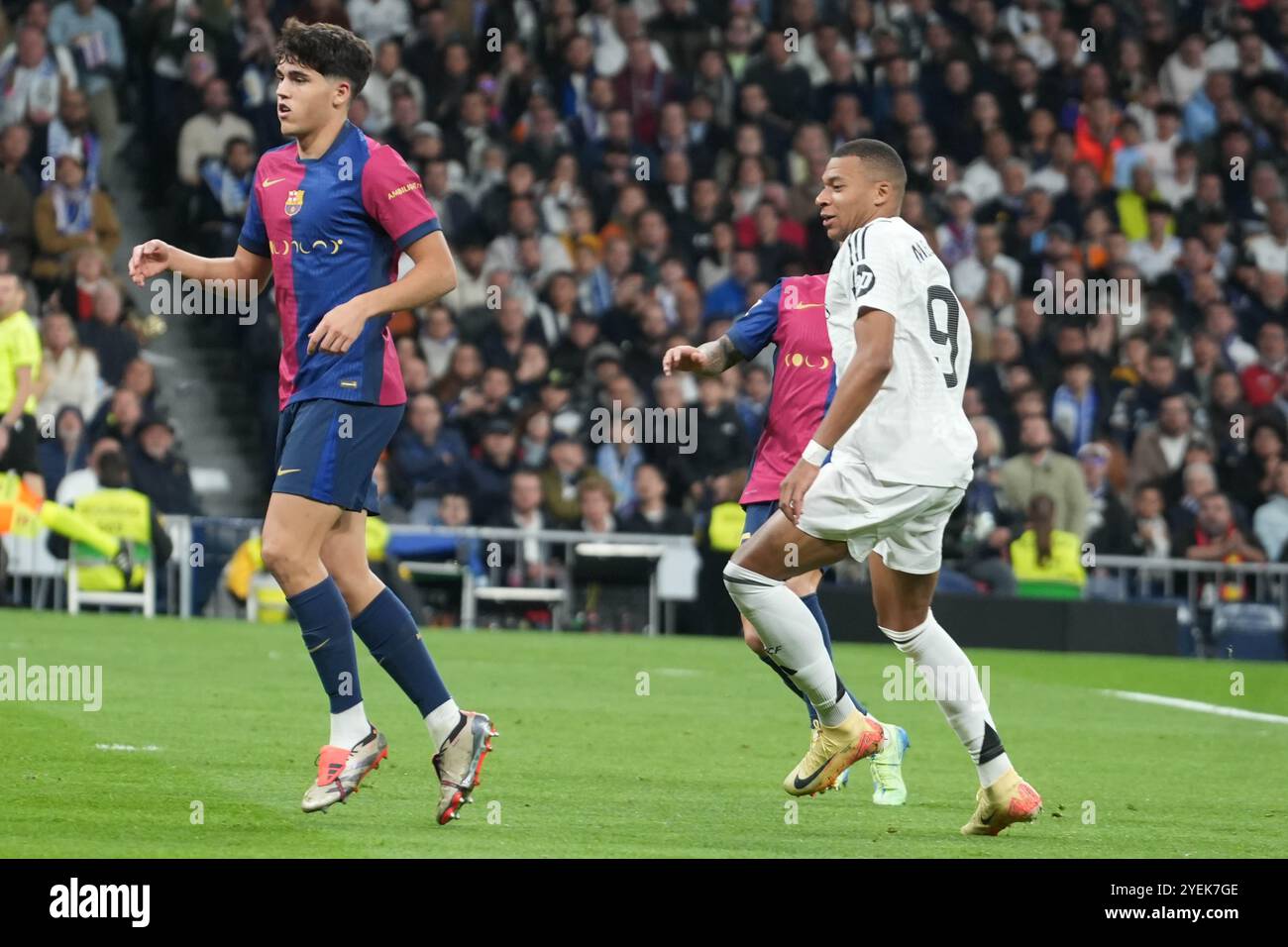 Pau Cubarsí of Barcelona and Kylian Mbappé of Real Madrid during the ...