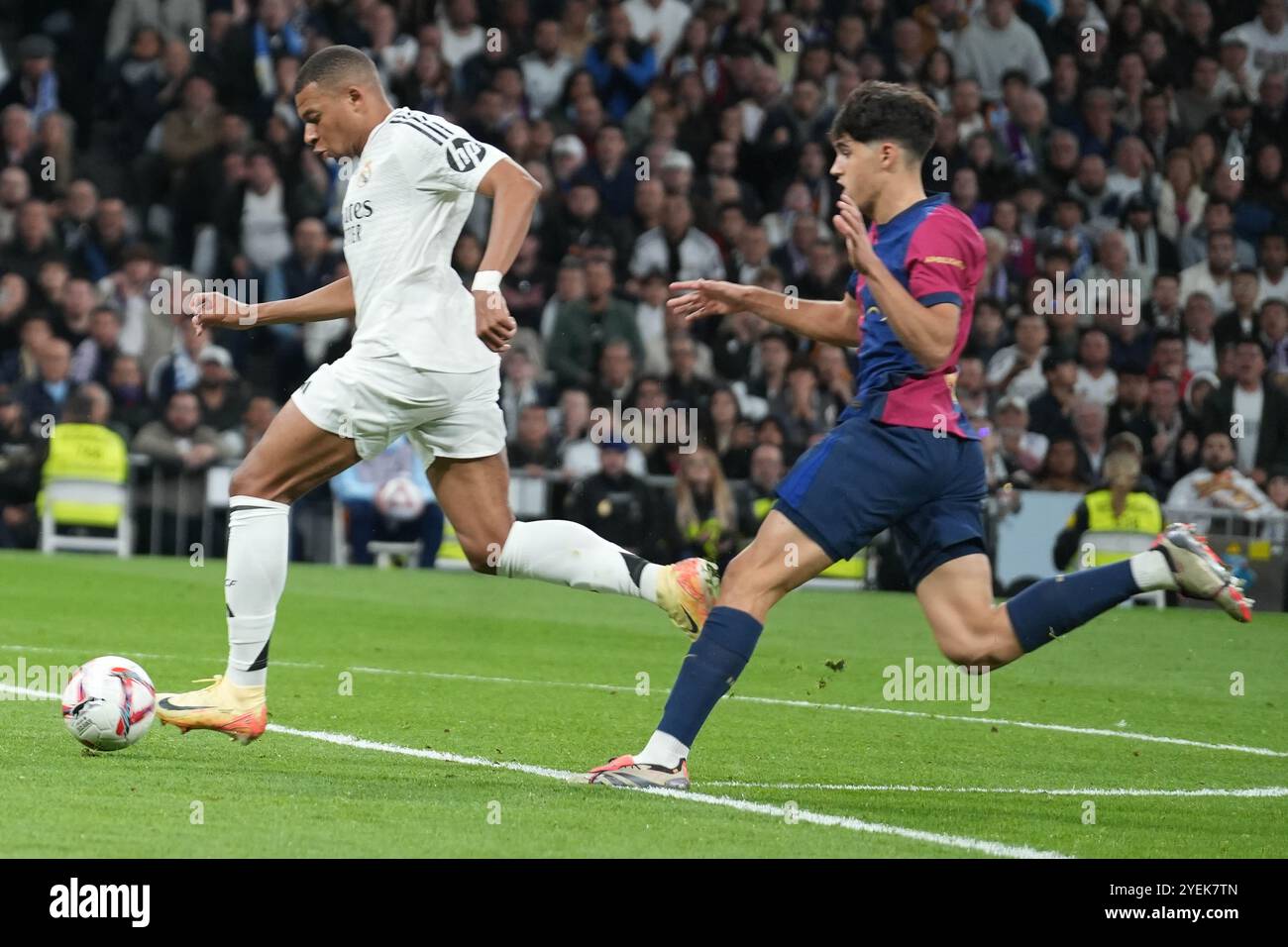 Pau Cubarsí of Barcelona and Kylian MBAPPE of Real Madrid during the ...