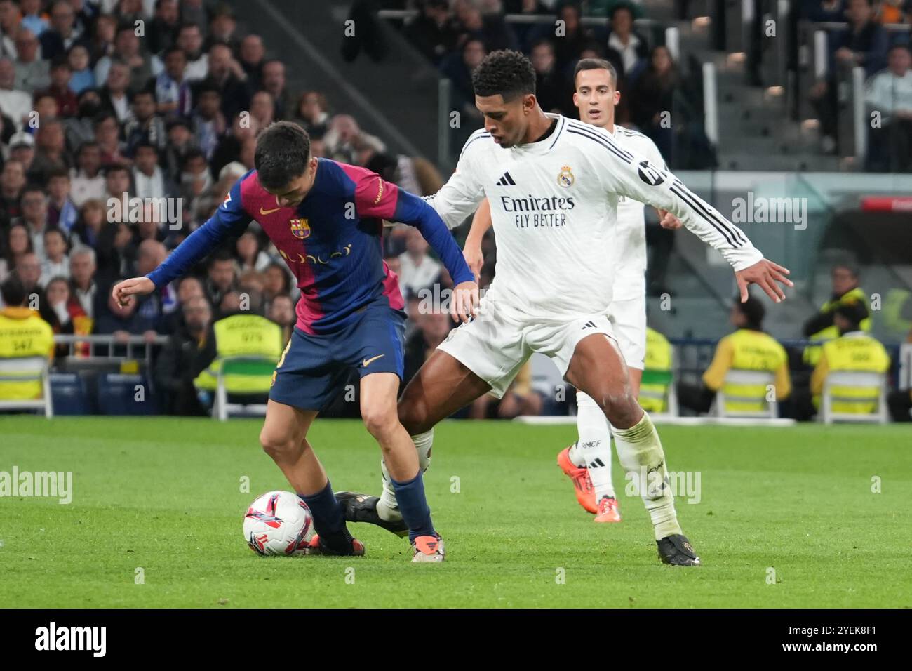 Pedri of Barcelona and Jude Bellingham of Real Madrid during the ...