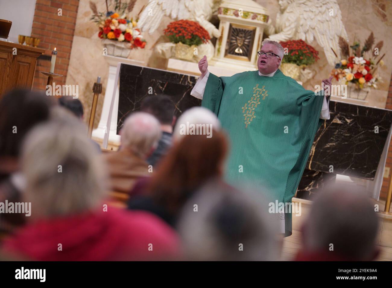 The Rev. Tim Biren leads the English-language Mass at St. Mary’s ...