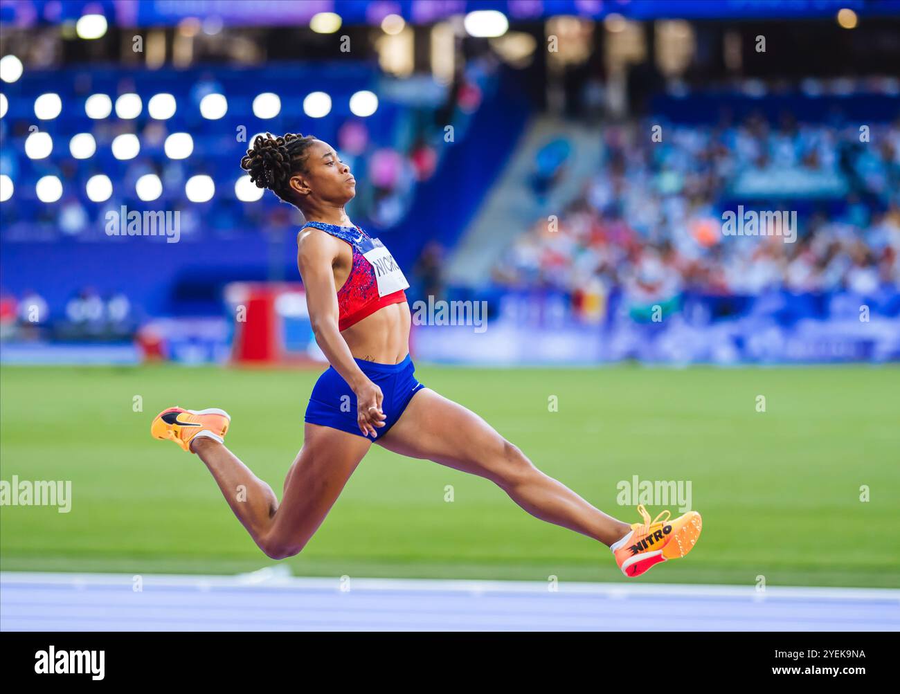 Monae' Nichols participating in the long jump at the Paris 2024 Olympic ...