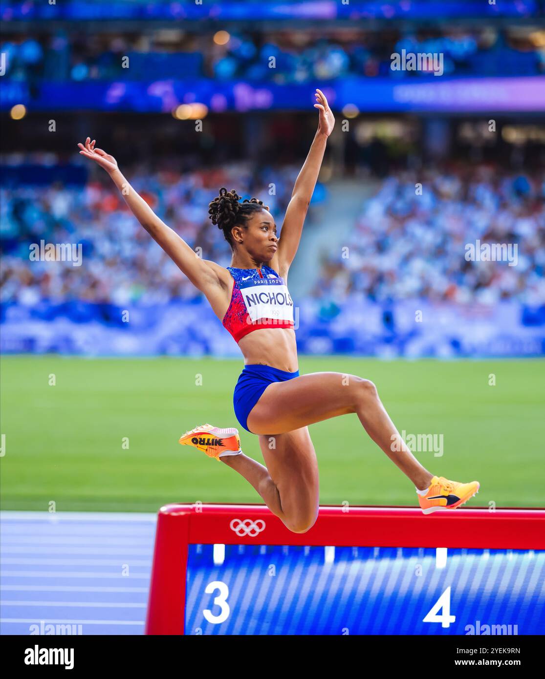 Monae' Nichols participating in the long jump at the Paris 2024 Olympic ...