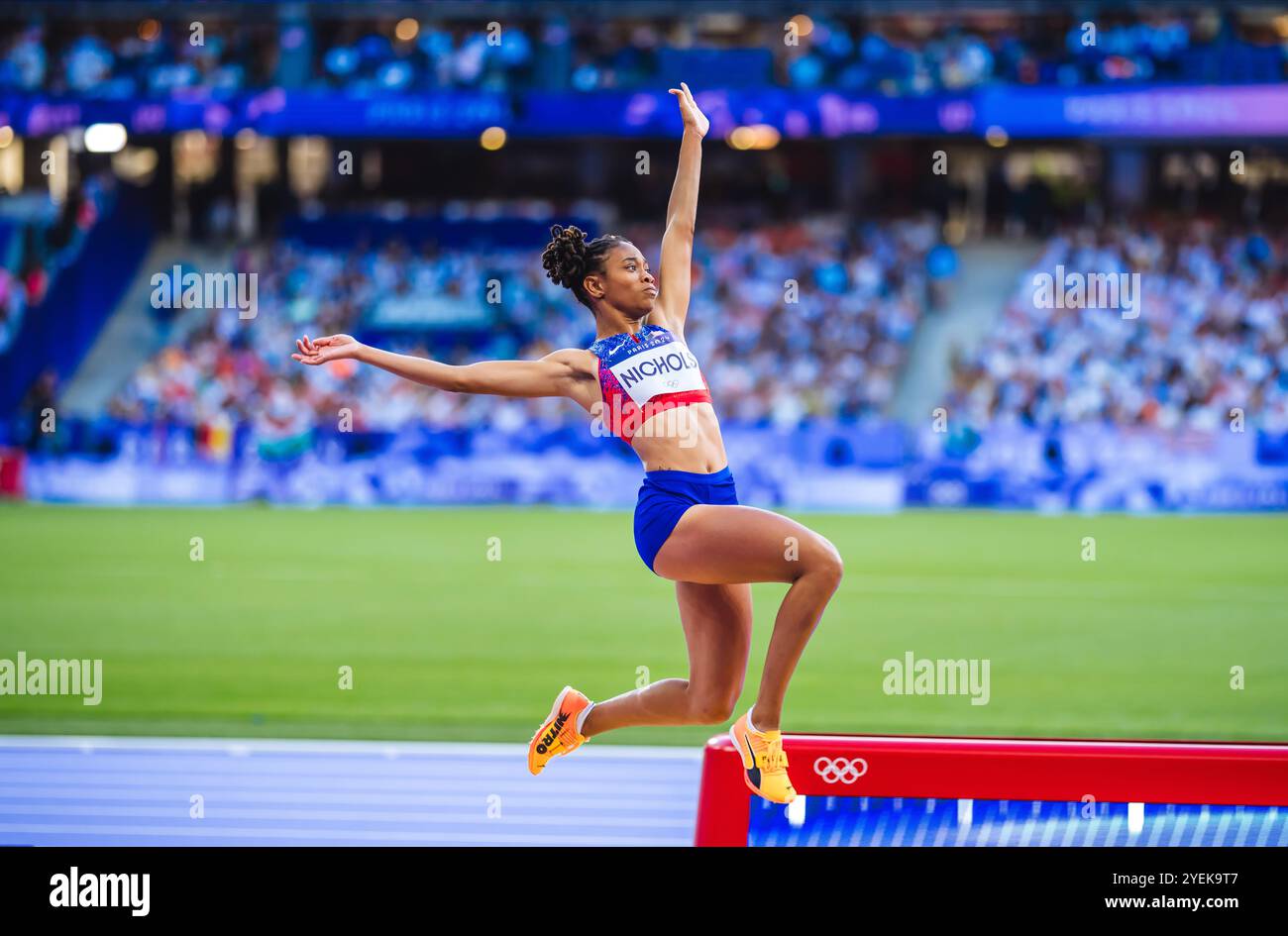 Monae' Nichols participating in the long jump at the Paris 2024 Olympic ...