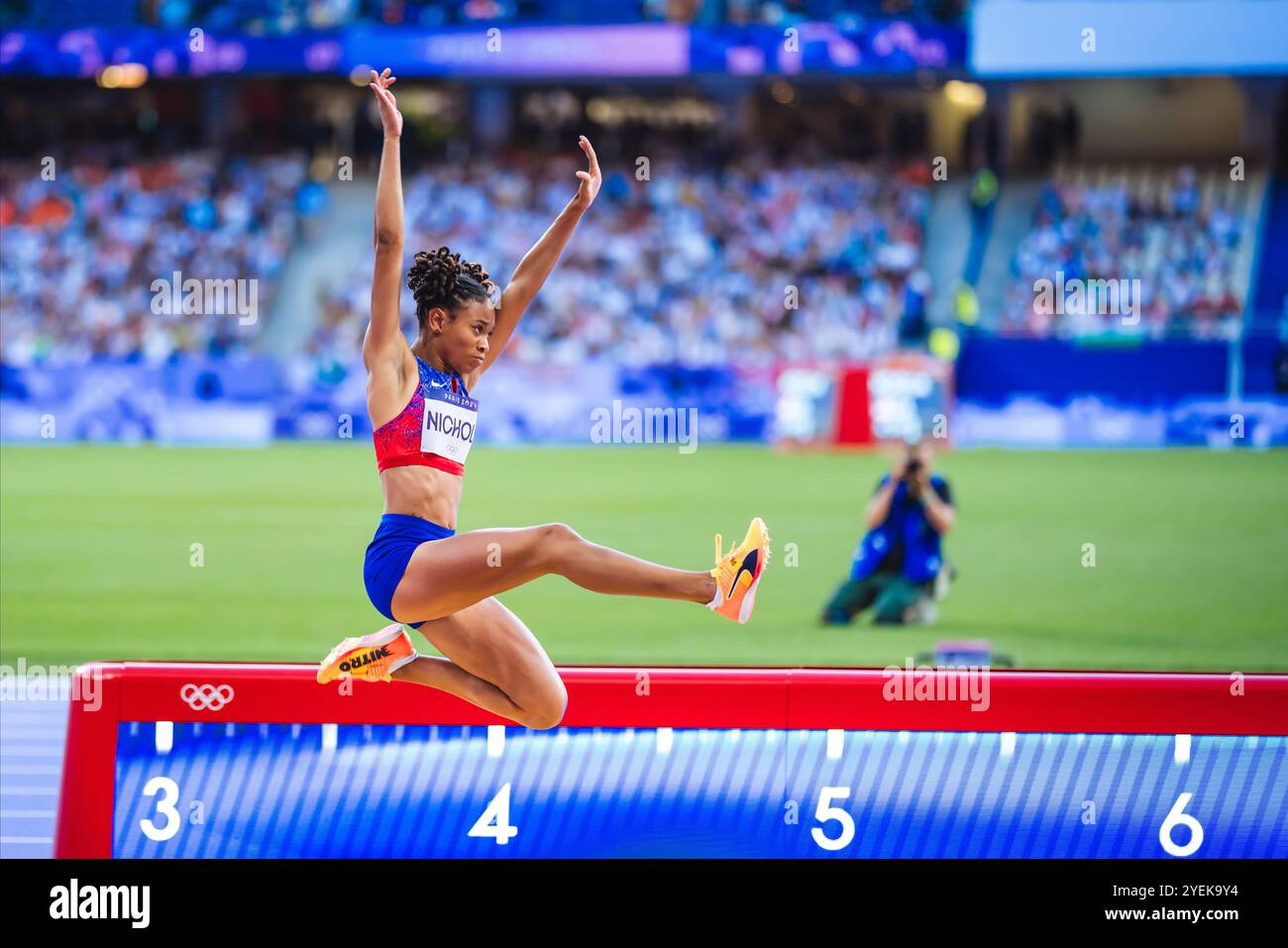 Monae' Nichols participating in the long jump at the Paris 2024 Olympic ...