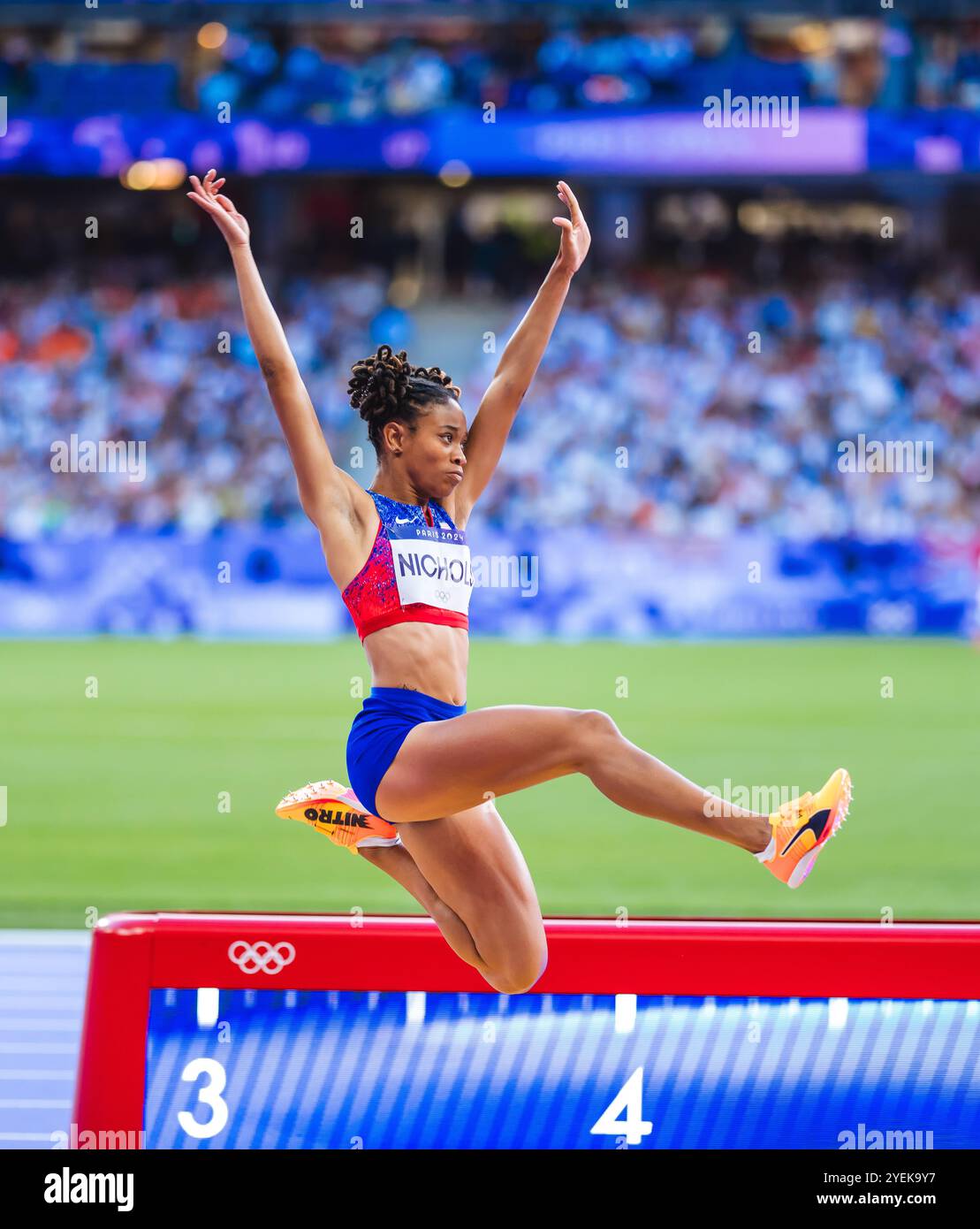 Monae' Nichols participating in the long jump at the Paris 2024 Olympic ...