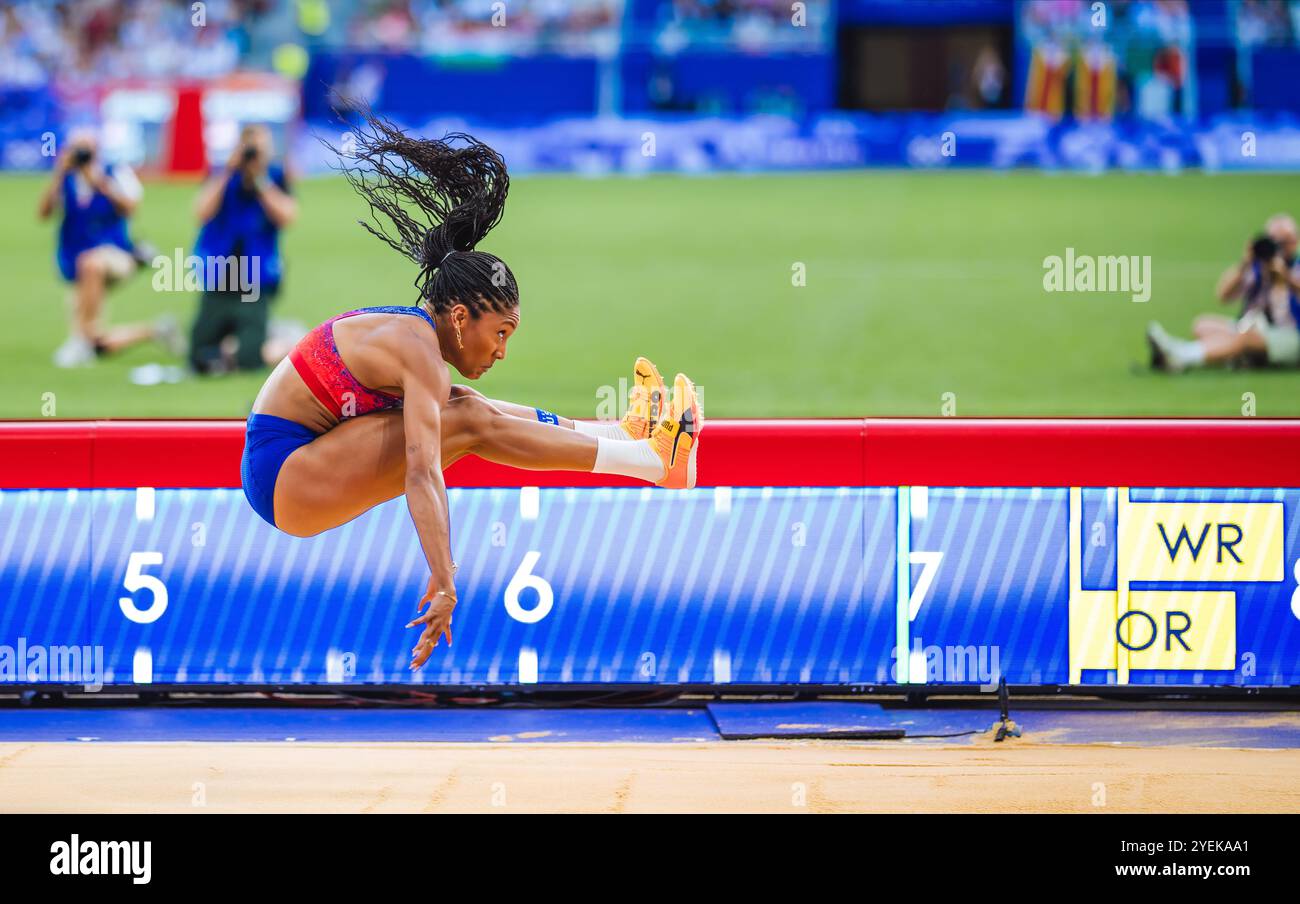 Tara Davis-Woodhall participating in the long jump at the Paris 2024 ...