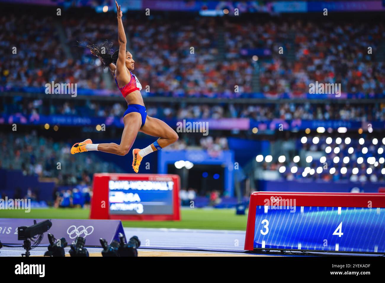 Tara Davis-Woodhall participating in the long jump at the Paris 2024 ...