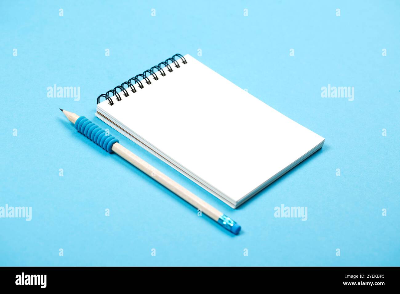 Spiral notepad with pencil as mockup for design Stock Photo - Alamy