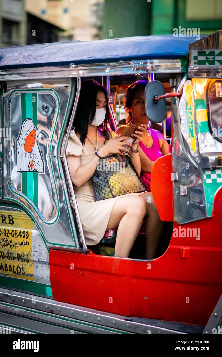 Filipino ladies and passengers sat on board a jeepney in Manila The ...