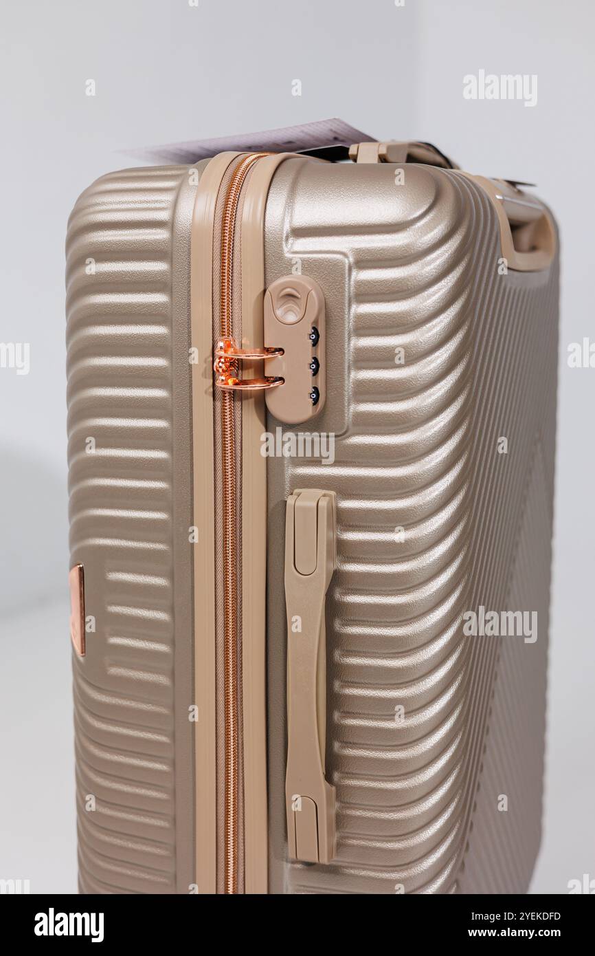 Golden suitcases with wheels isolated on white background. Suitcase for ...