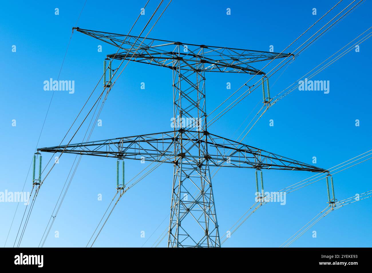 Ultra-high voltage pylons in the countryside, illustration of ...