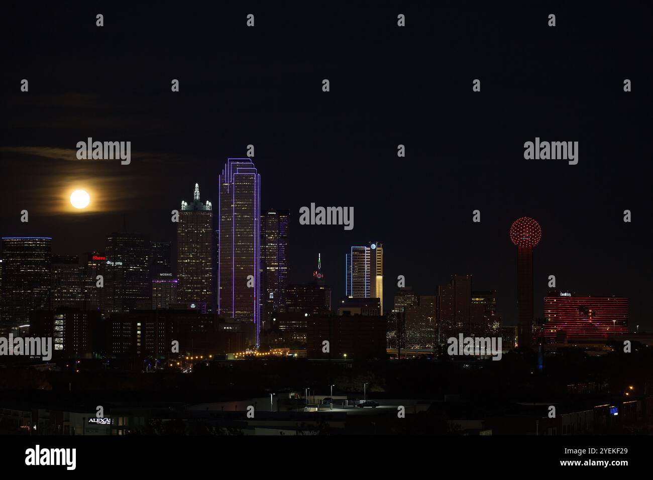 Eerie Moon Glows Througs Clouds Over The Downtown Dallas, Texas Skyline ...