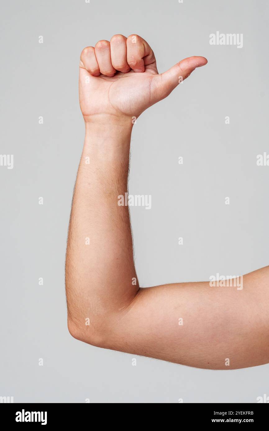 A person hand gesture against a neutral background Stock Photo - Alamy