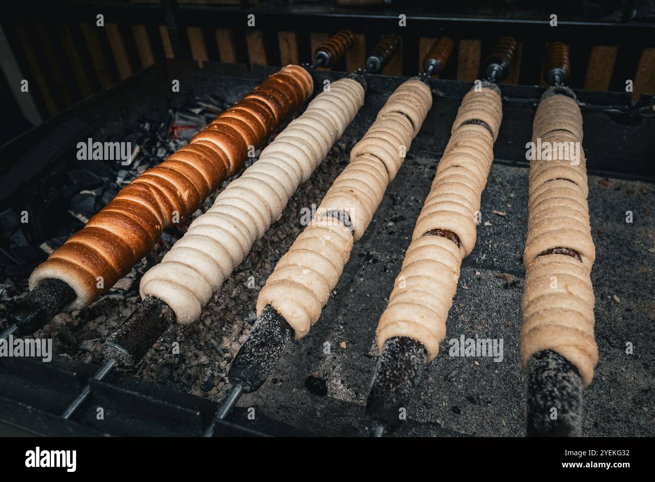 Trdlo typical Czech pastries are roasted on fire at a street market in ...