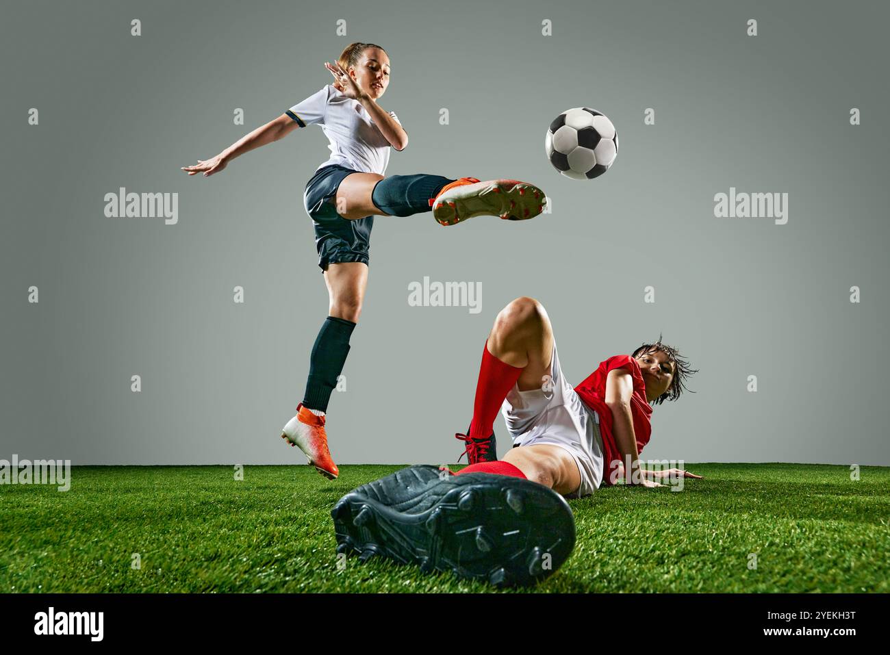 Female soccer players hitting ball hi-res stock photography and images ...