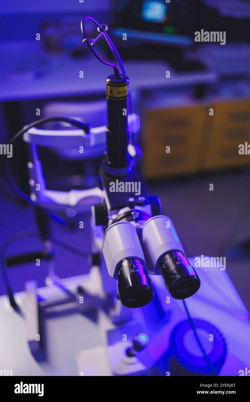 A modern microscope for vision testing in a light room. Microscope for ...