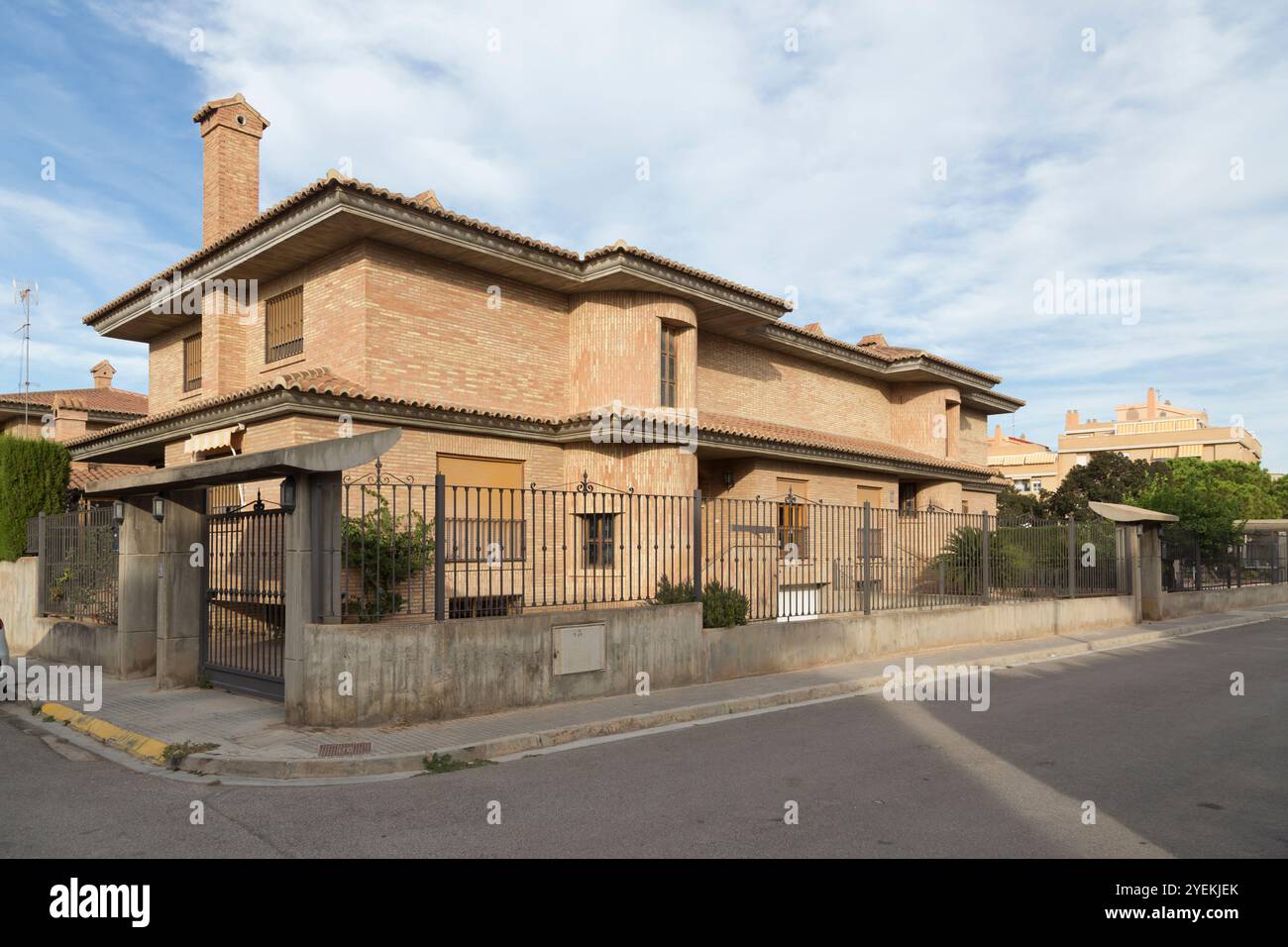 Imposing single-family house with exposed brick facade and prominent ...