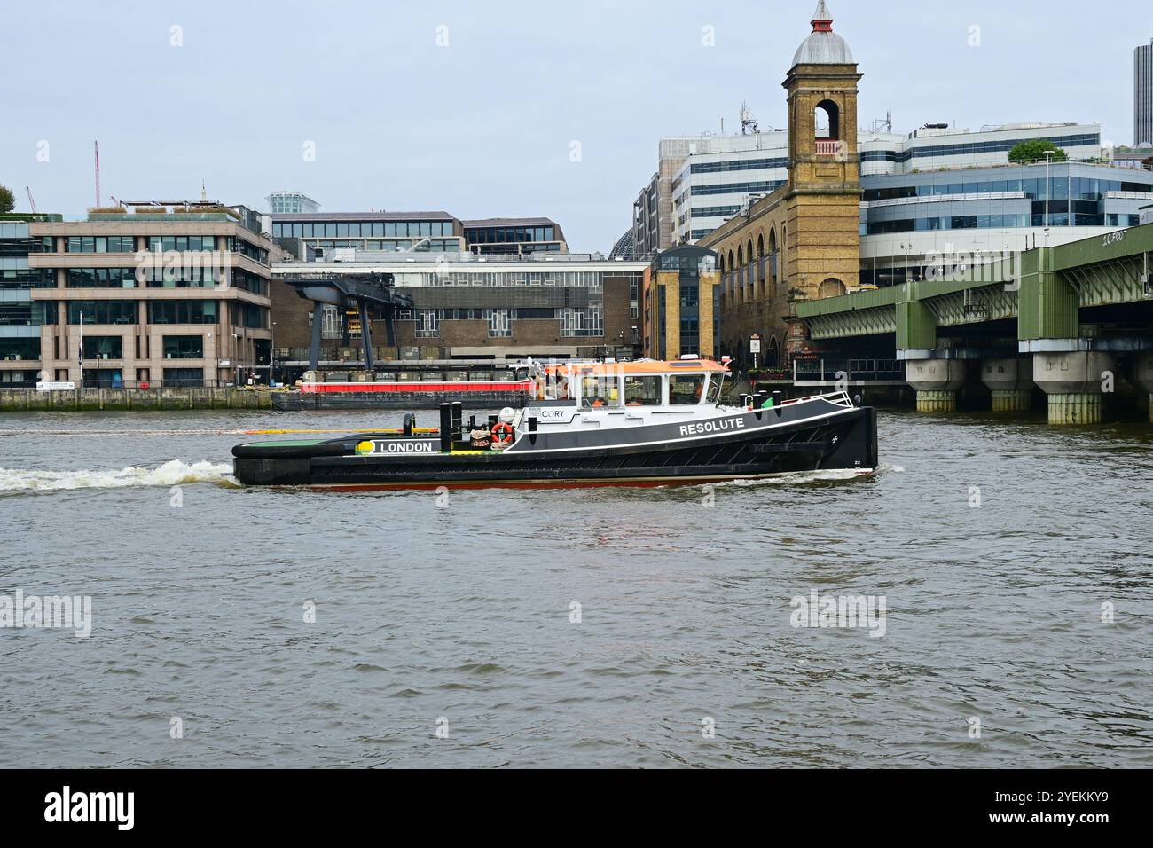 Cory tug Resolute towing barges of containers downstream and ...