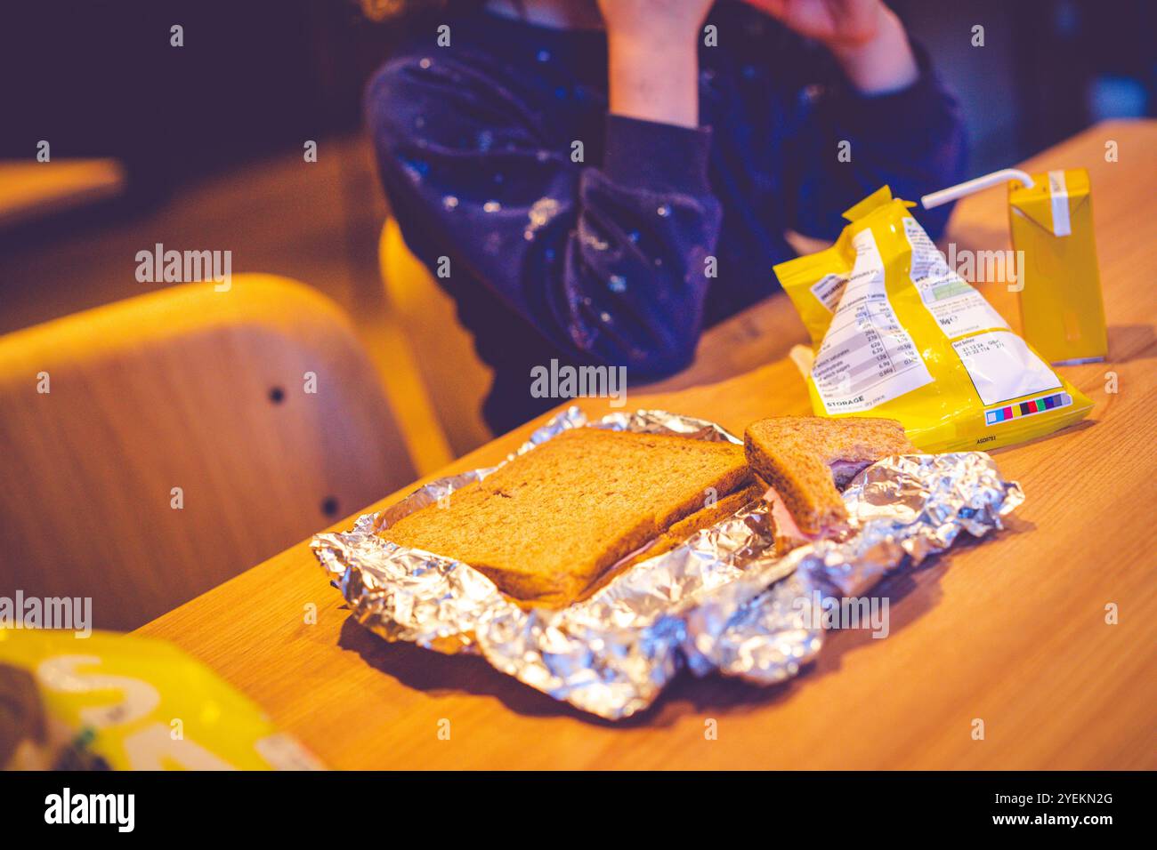 Girl eating packed lunch Stock Photo - Alamy