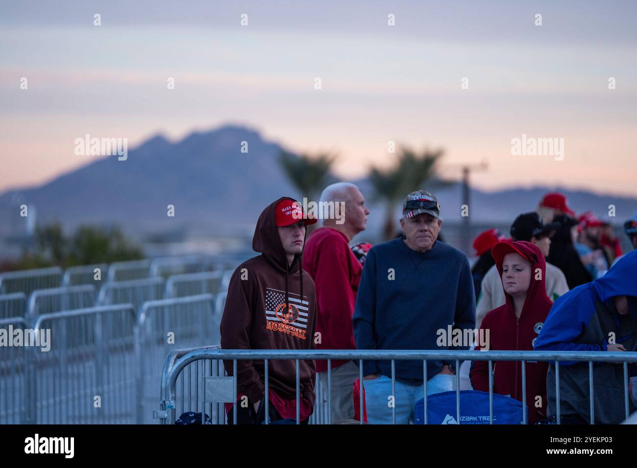People wait in line for a campaign rally for Republican presidential ...