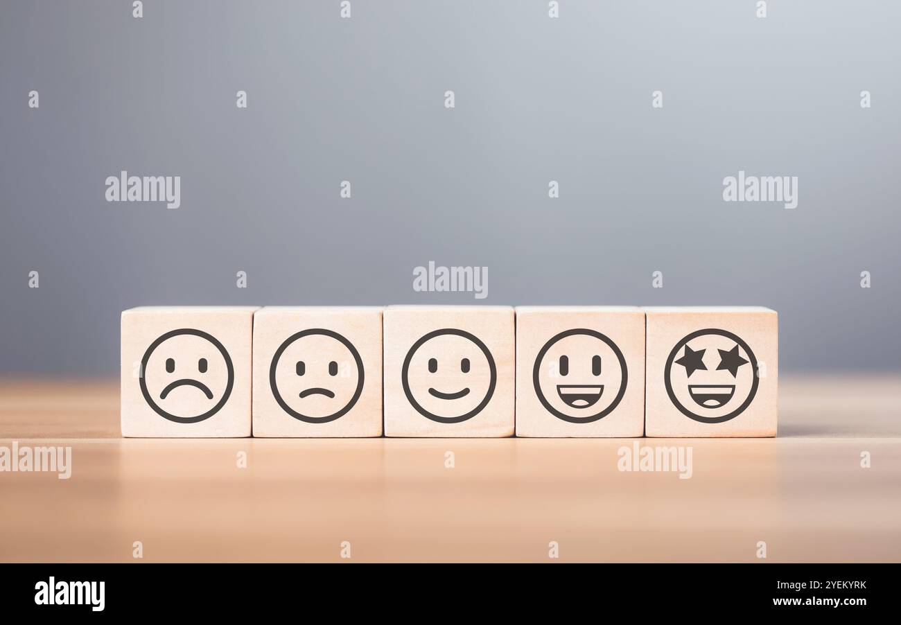 Wooden blocks display a range of emotions from sad to happy, with a ...