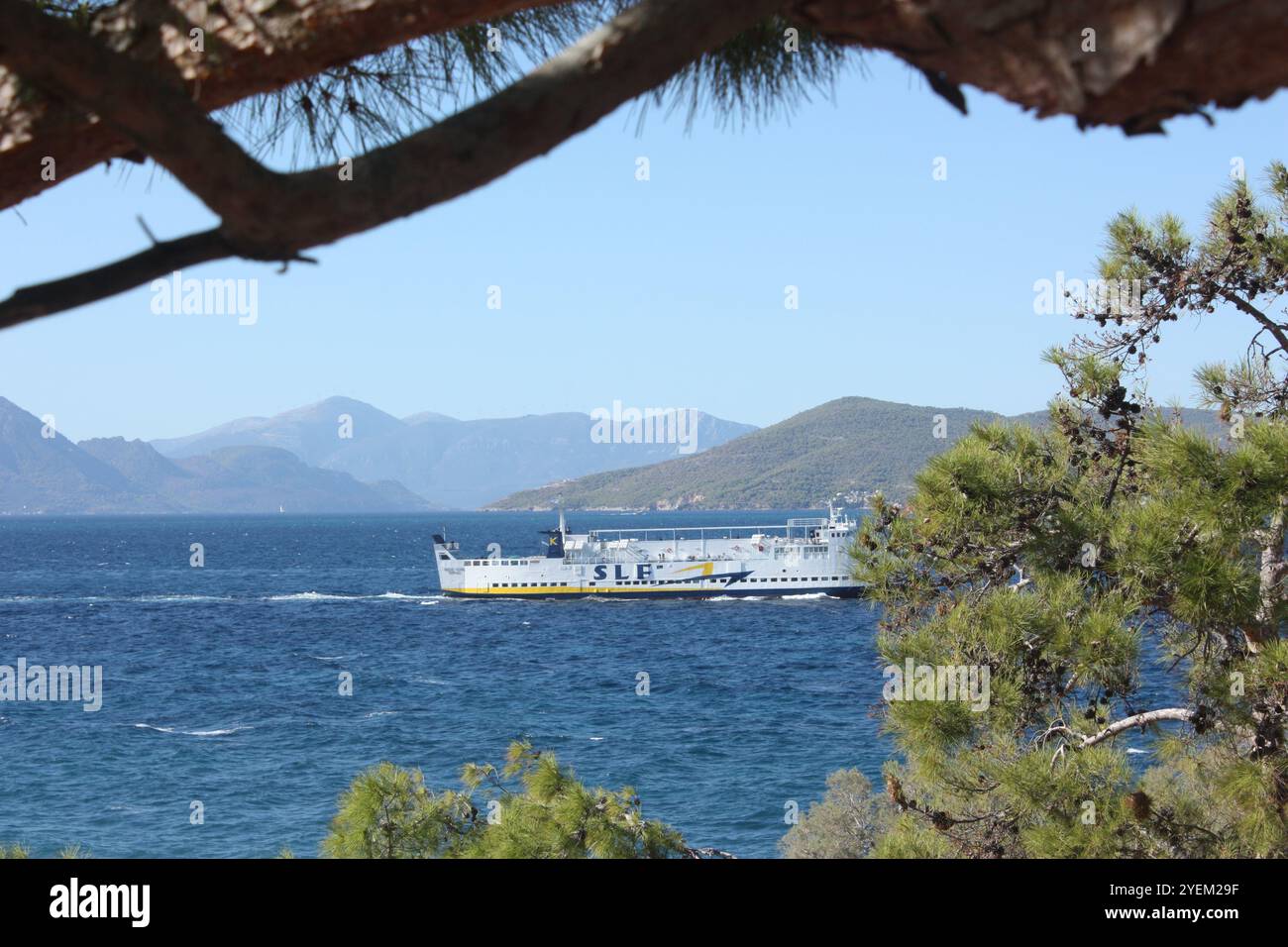 A ferry heading for Piraeus seen from the Temple of Apollo, Aegina ...