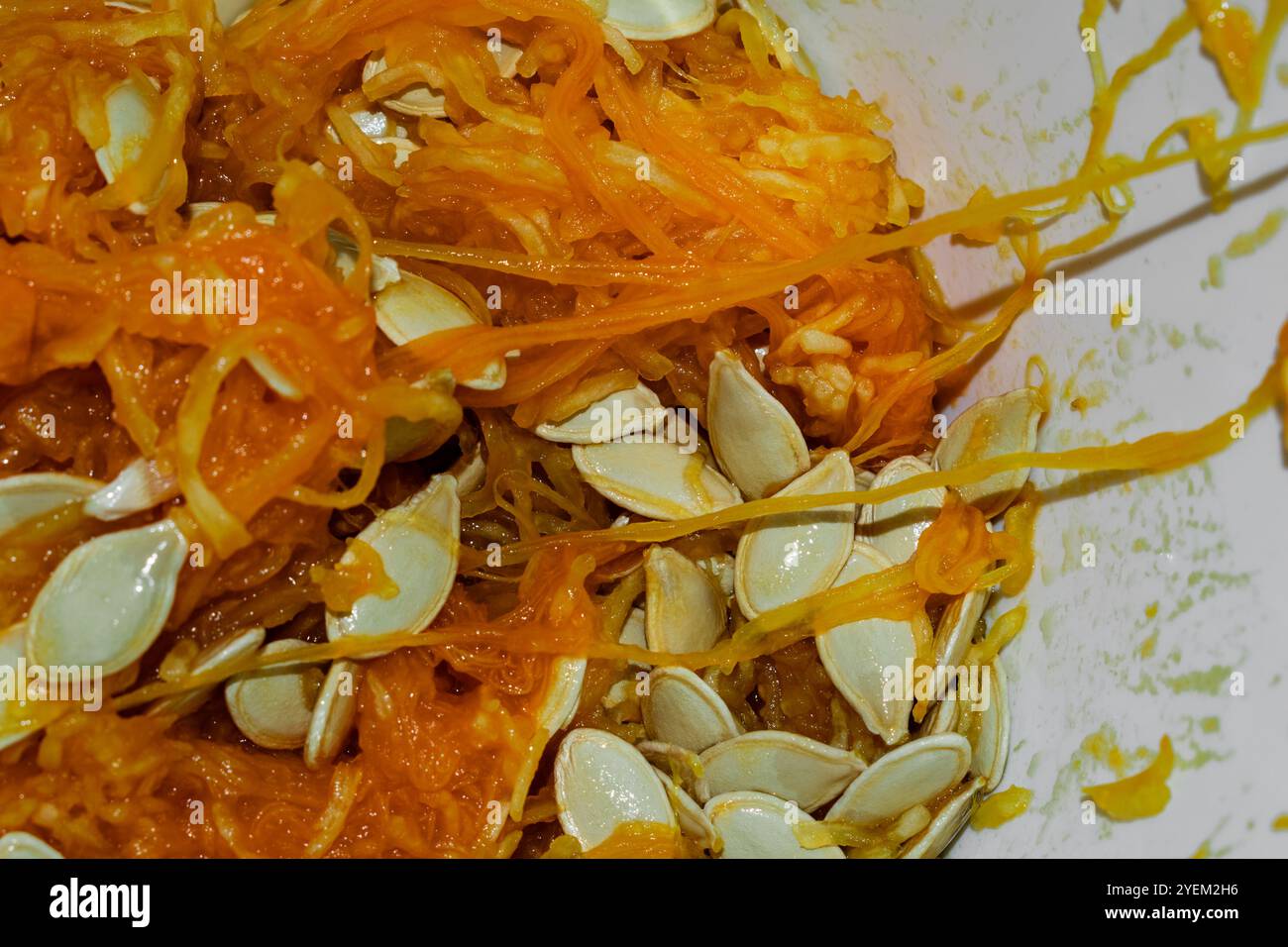 Raw pumpkin seeds and squash freshly extracted from the pumpkin Stock ...