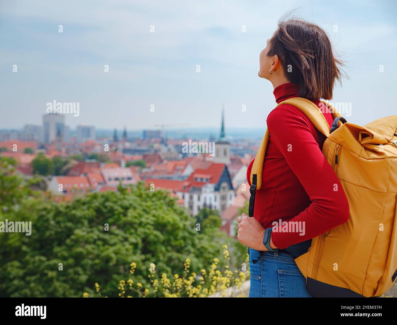 Tourist woman explores beautiful city of Erfurt, wandering through its ...