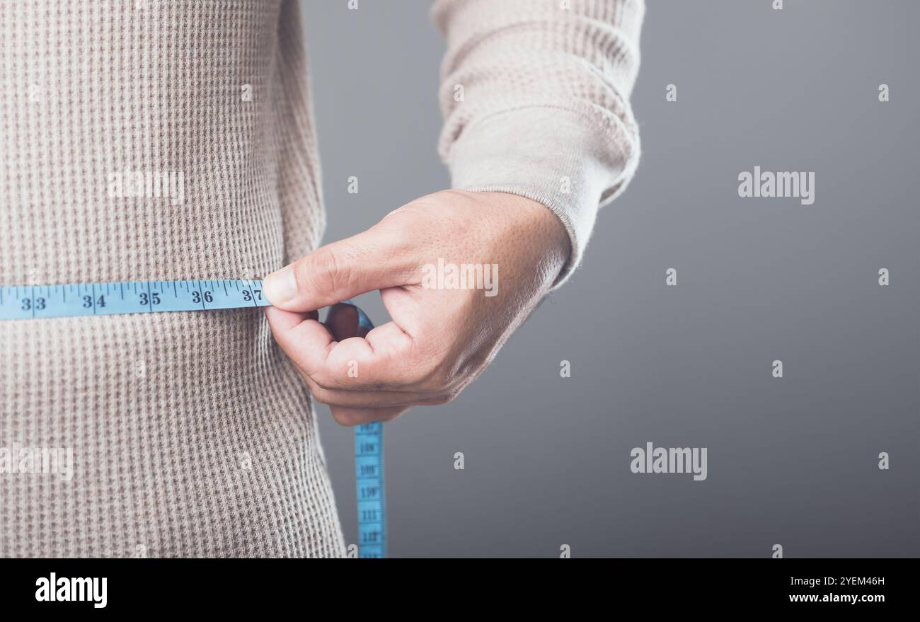 Measuring hips using tape hi-res stock photography and images - Alamy