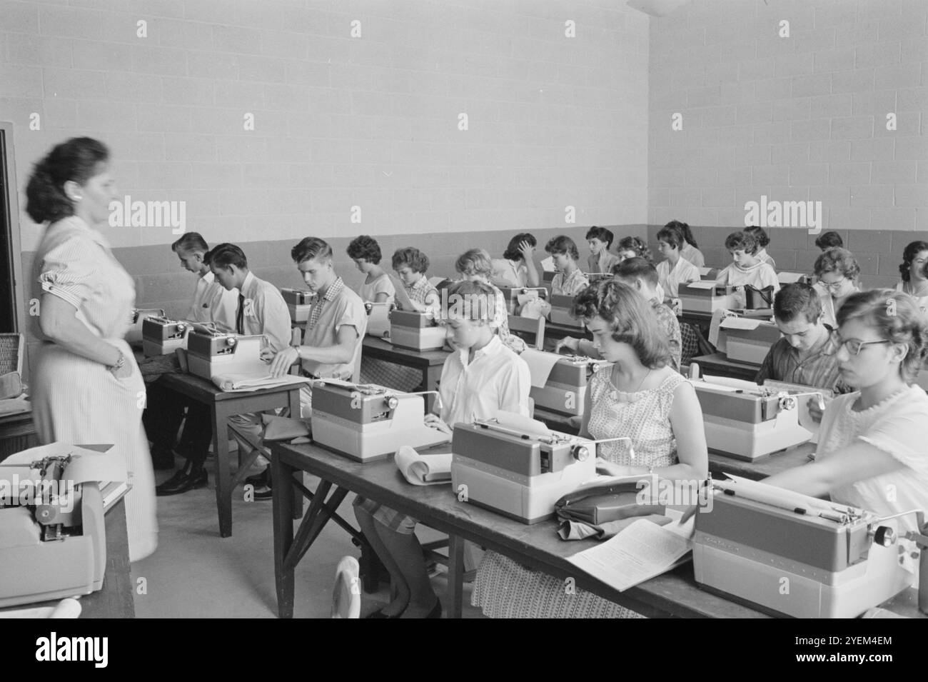 Students in a classroom using typewriters at a private whites-only ...