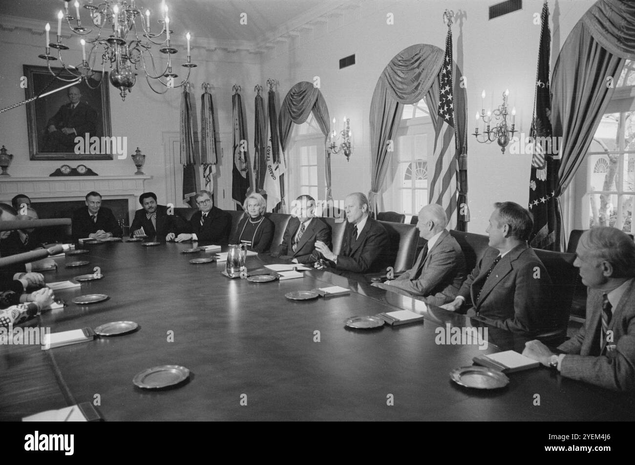 President Gerald Ford seated at a conference table at the White House ...