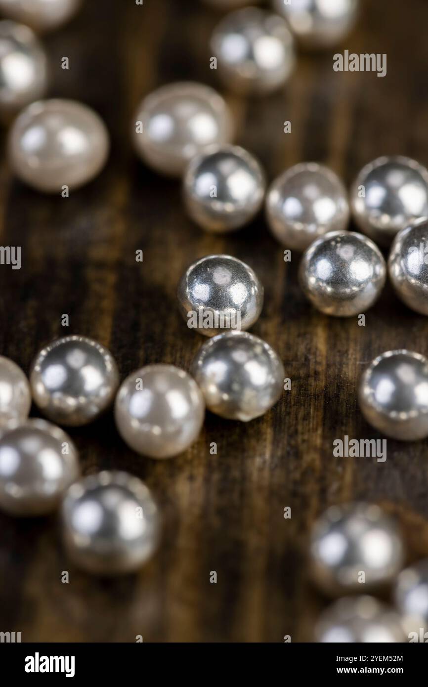 round candies with a shiny surface, sweet sugar candies for decorating ...