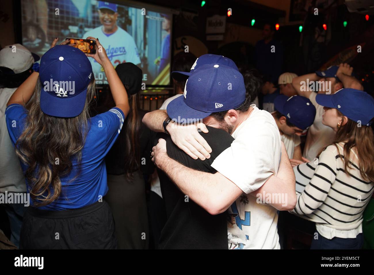 Two fans embrace as they celebrate the Los Angeles Dodger's World ...