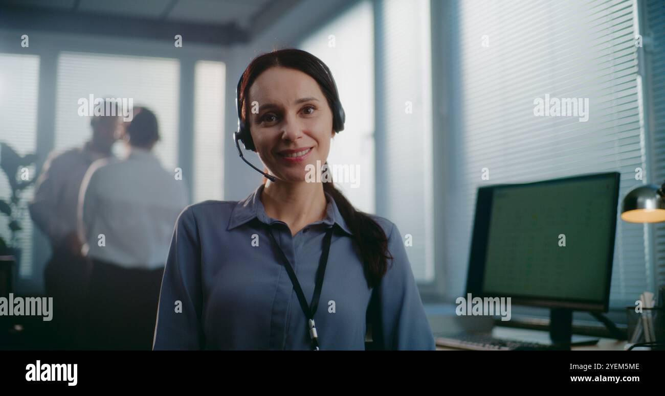 Call center office: Close up portrait of friendly Caucasian female technical customer support ...
