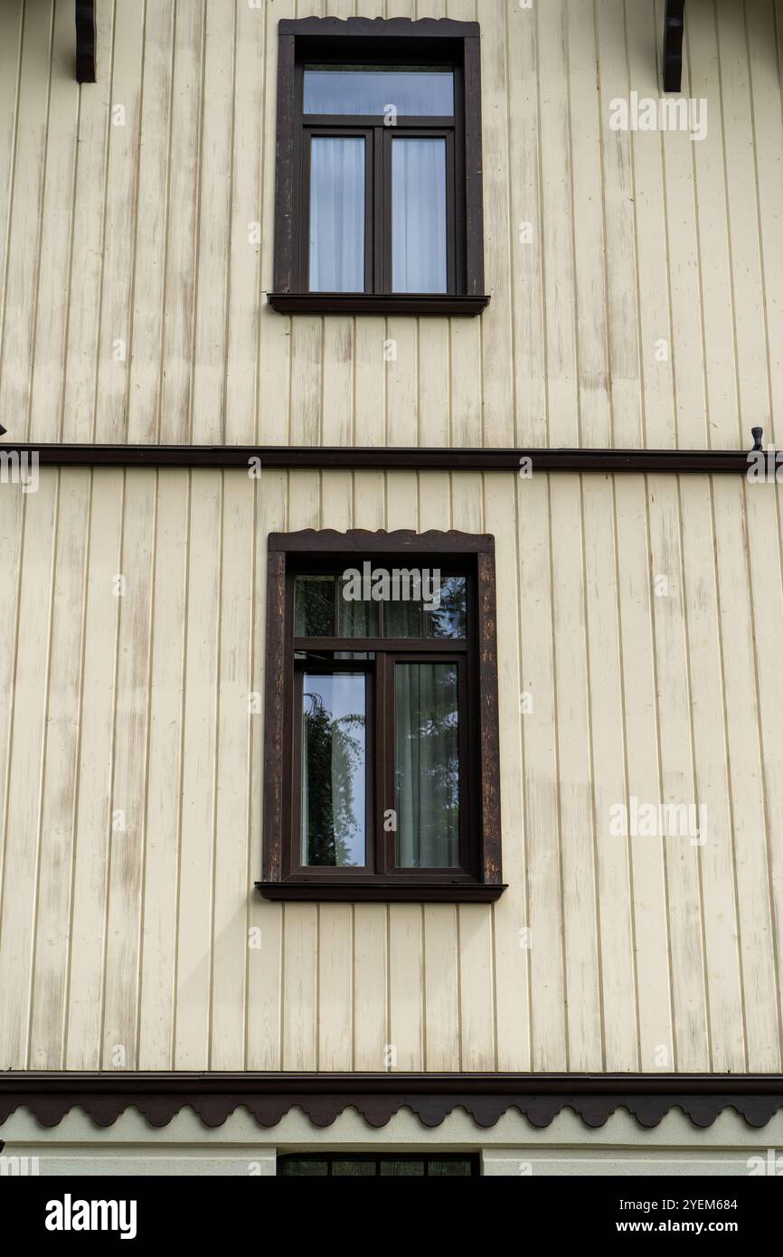 Old wooden windows house exterior Stock Photo - Alamy