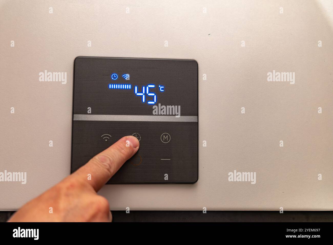 Electronic panel for setting the temperature in the water heater ...